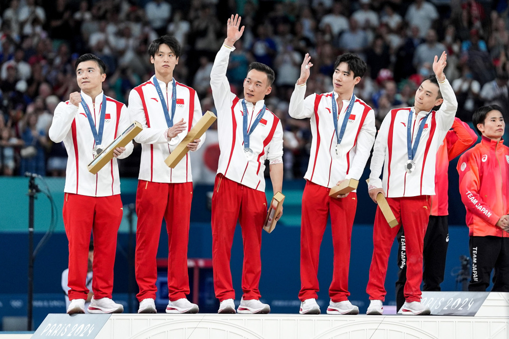 中国体操奥运成绩为何逐渐下滑？浅谈弃团体保单项的诱惑与困惑_腾讯新闻