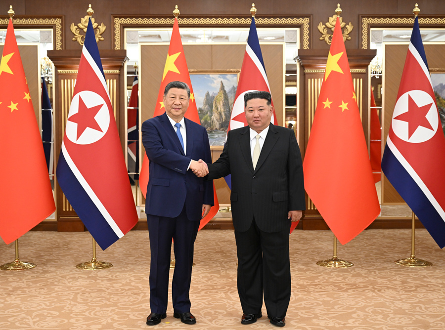 习近平同金正恩举行会谈_腾讯新闻