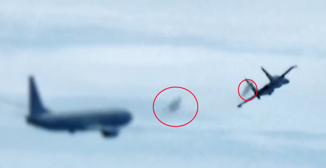 不再惯着：歼16横切P8A侦察机，还抛洒干扰弹，央视公开现场录像_腾讯新闻